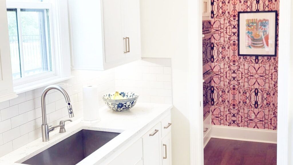 This designer's wallpaper placement creates the perfect pop of color ...